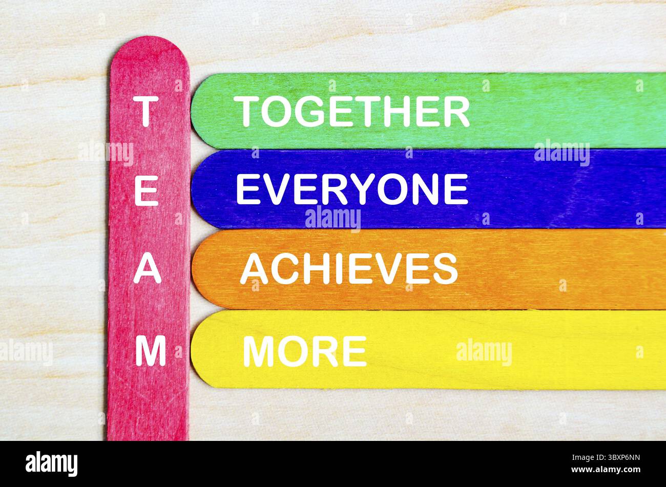 TEAM representing Together Everyone Achieves More text on wooden stick ...