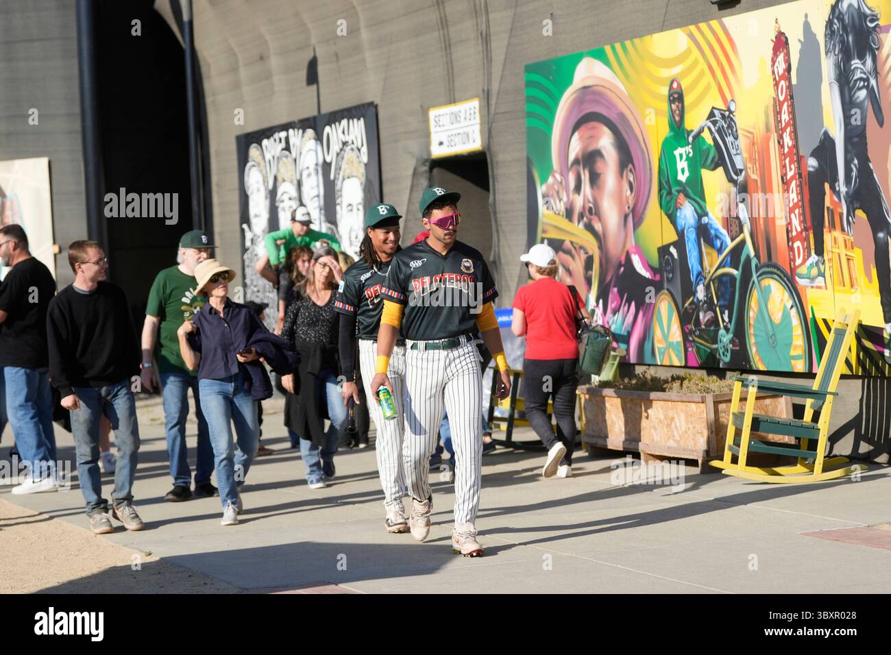 Oakland Ballers players walk to the field before a Pioneer League ...