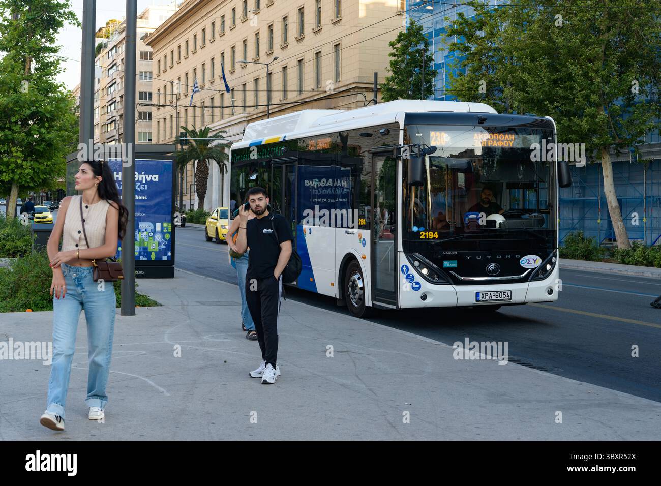 Public Bus Stop Scene in Athens, Greece — Electric Bus and Pedestrians ...