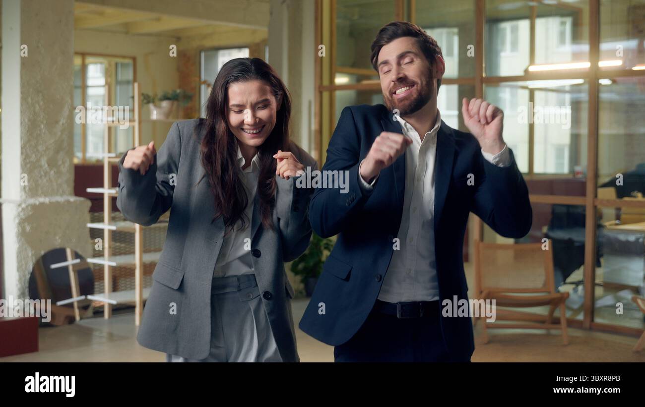 Funny business man woman dancing celebrating music party at office ...