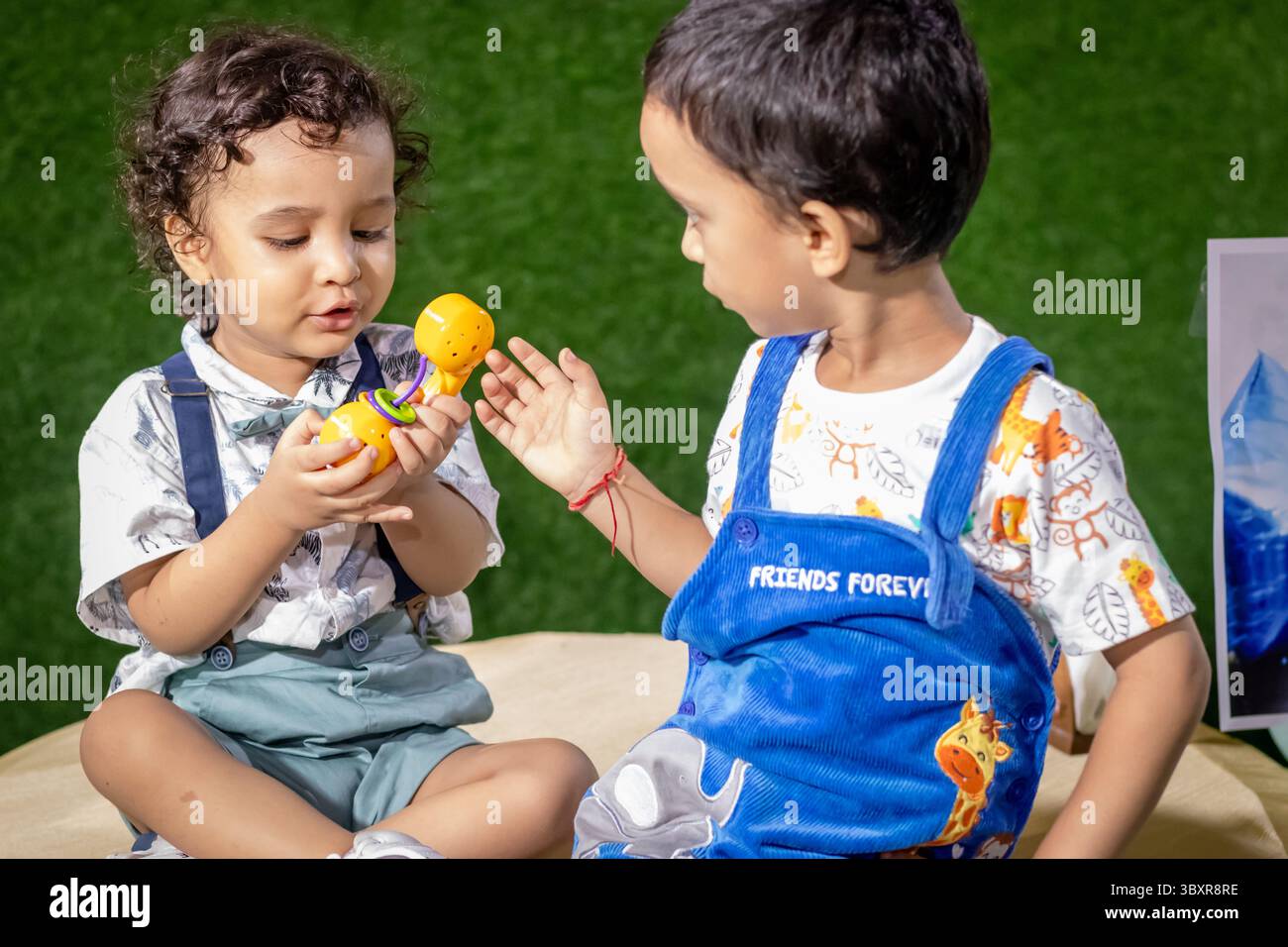 indian kid brothers sharing joyful birthday moment at indoor Stock ...