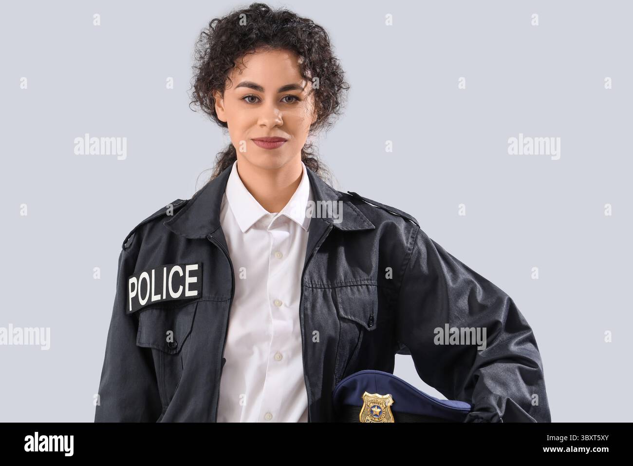 African-American female police officer on white background Stock Photo ...