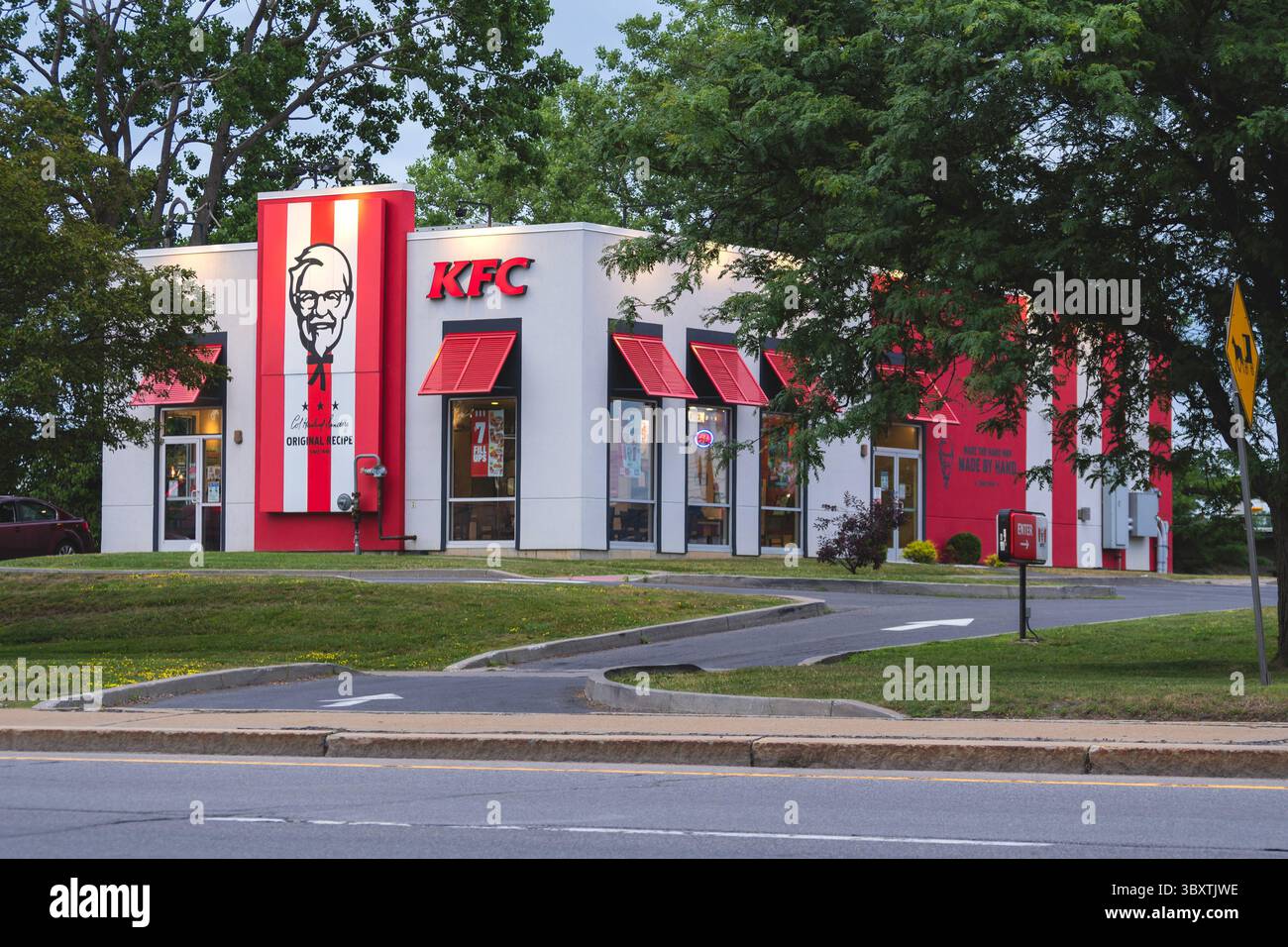 Utica, NY - Jul 9, 2025: Close-up night view of KFC (Kentucky Fried ...