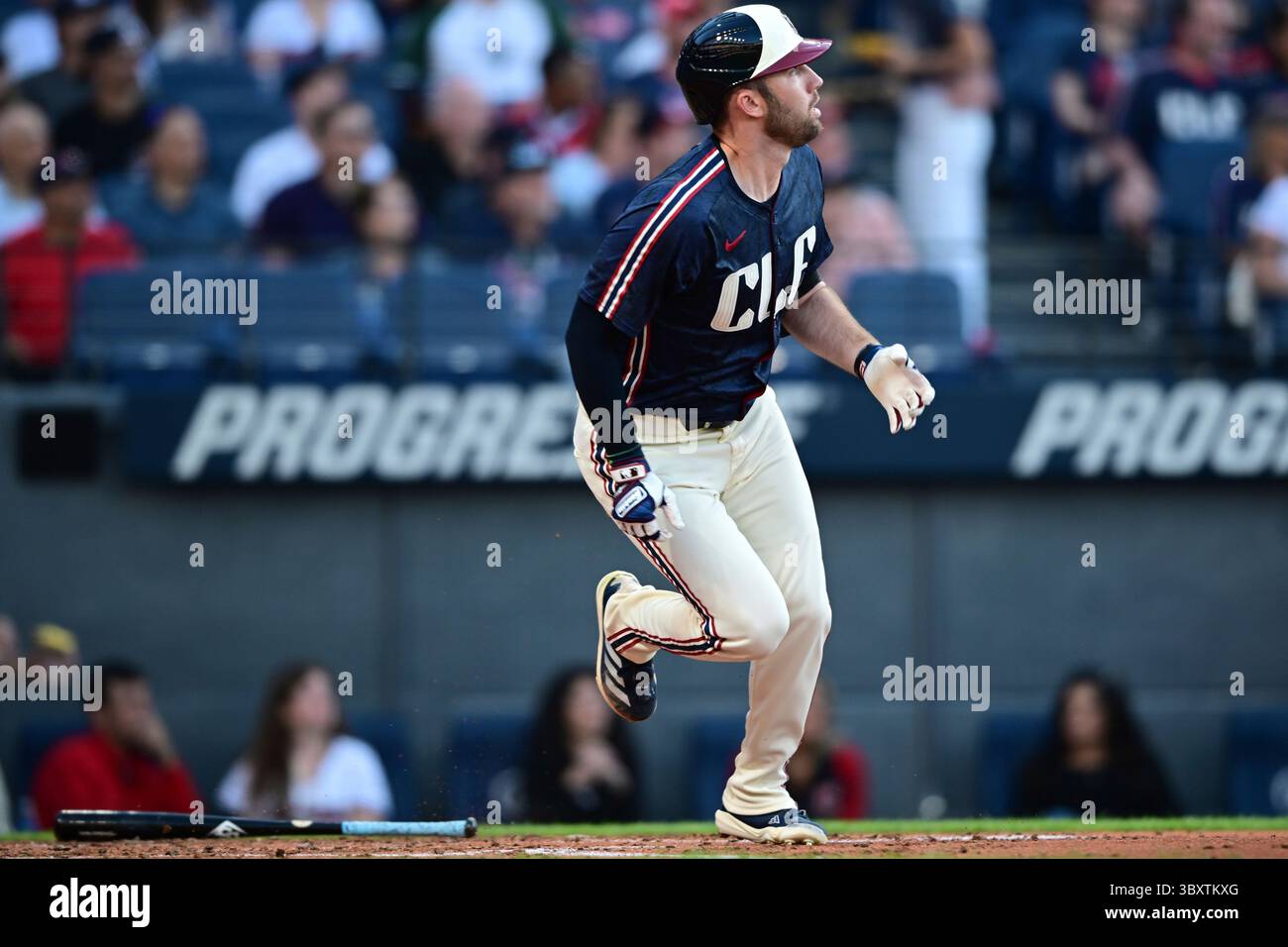 Cleveland Guardians first base David Fry watches his ball after hitting ...