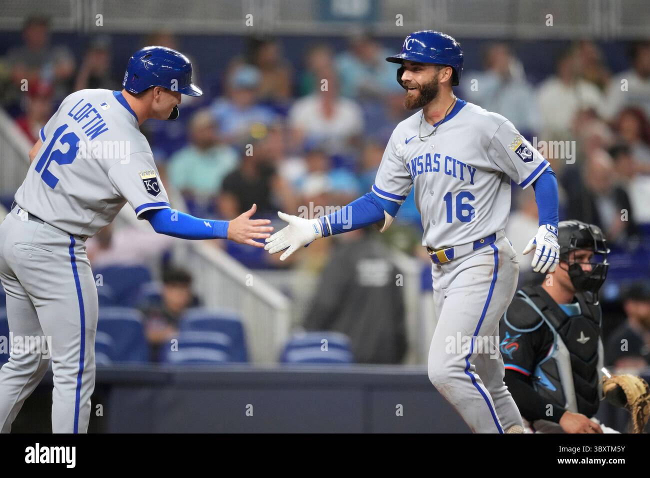 Kansas City Royals John Rave, right, celebrates as he crosses home ...