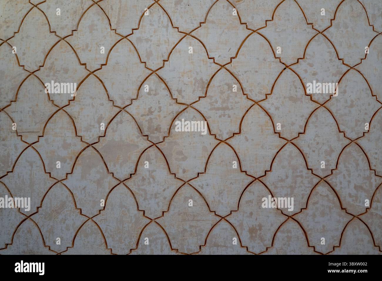 Arches intertwine in an ornate wall pattern at the Alhambra, a palace ...