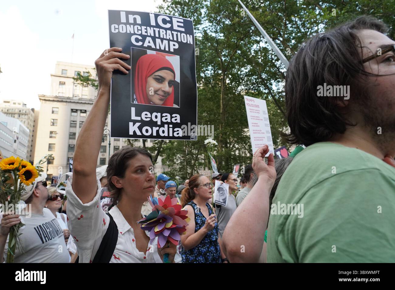 A protester holds up a placard expressing her opinion during the ...