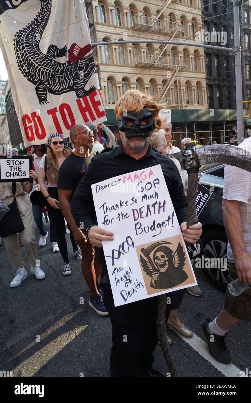 A protestor holds a placard expressing his opinion during the ...