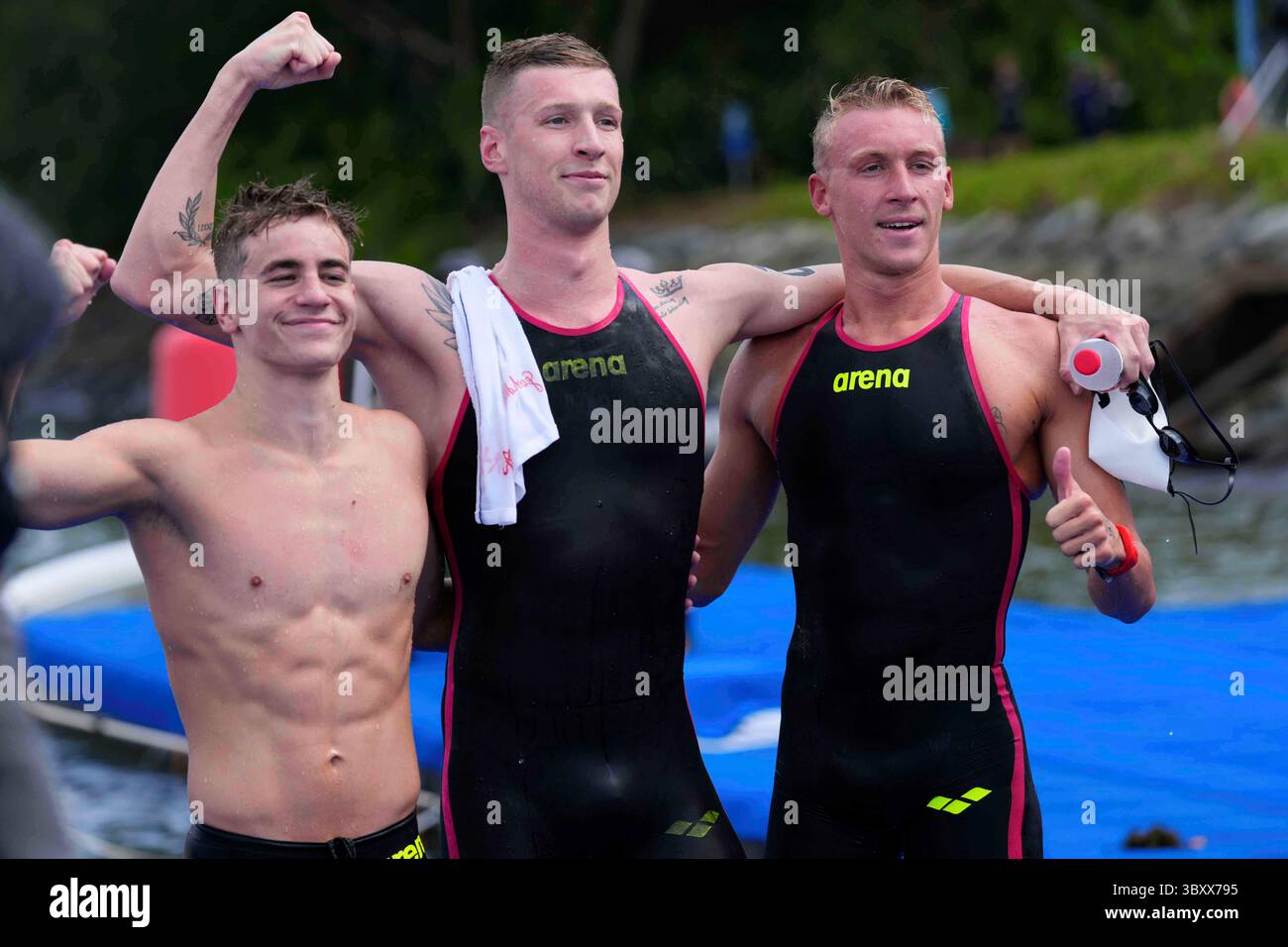 First-place winner Florian Wellbrock of Germany, center, poses with ...
