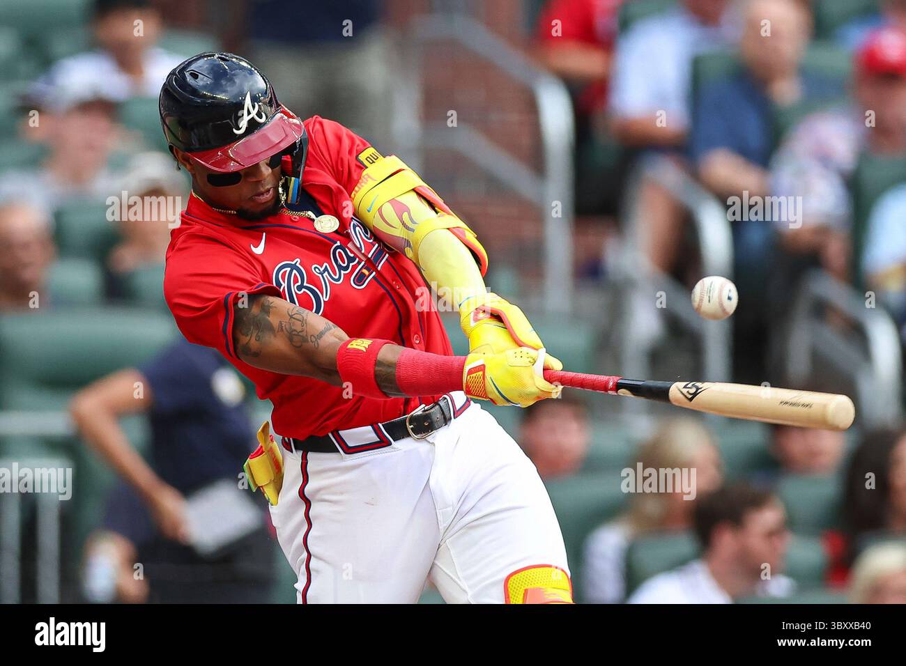 Atlanta Braves' Ronald Acuña Jr. hits an RBI double in the first inning ...