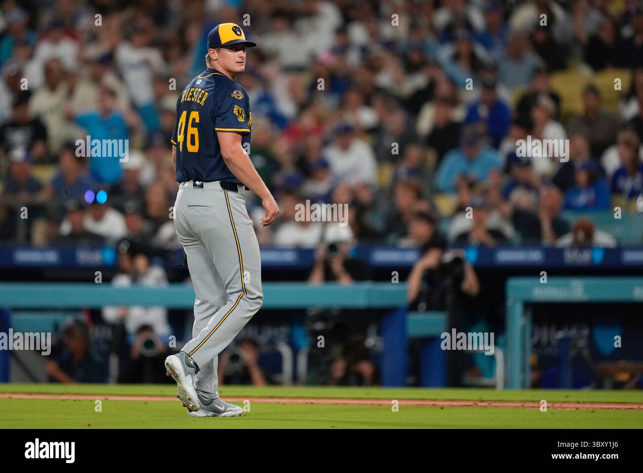 Milwaukee Brewers starting pitcher Quinn Priester walks off after ...