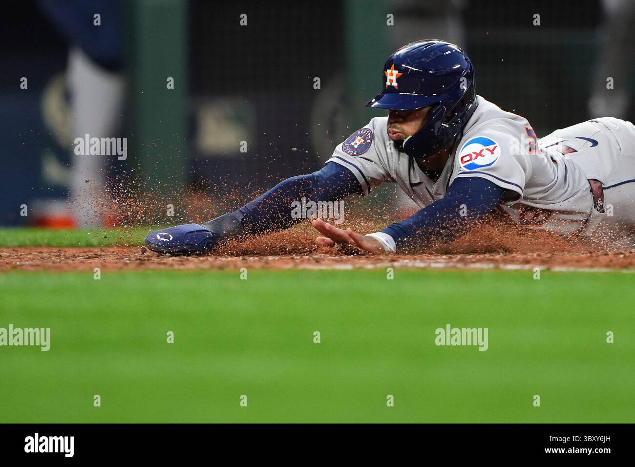 Houston Astros' Brice Matthews slides home to score on an RBI single ...