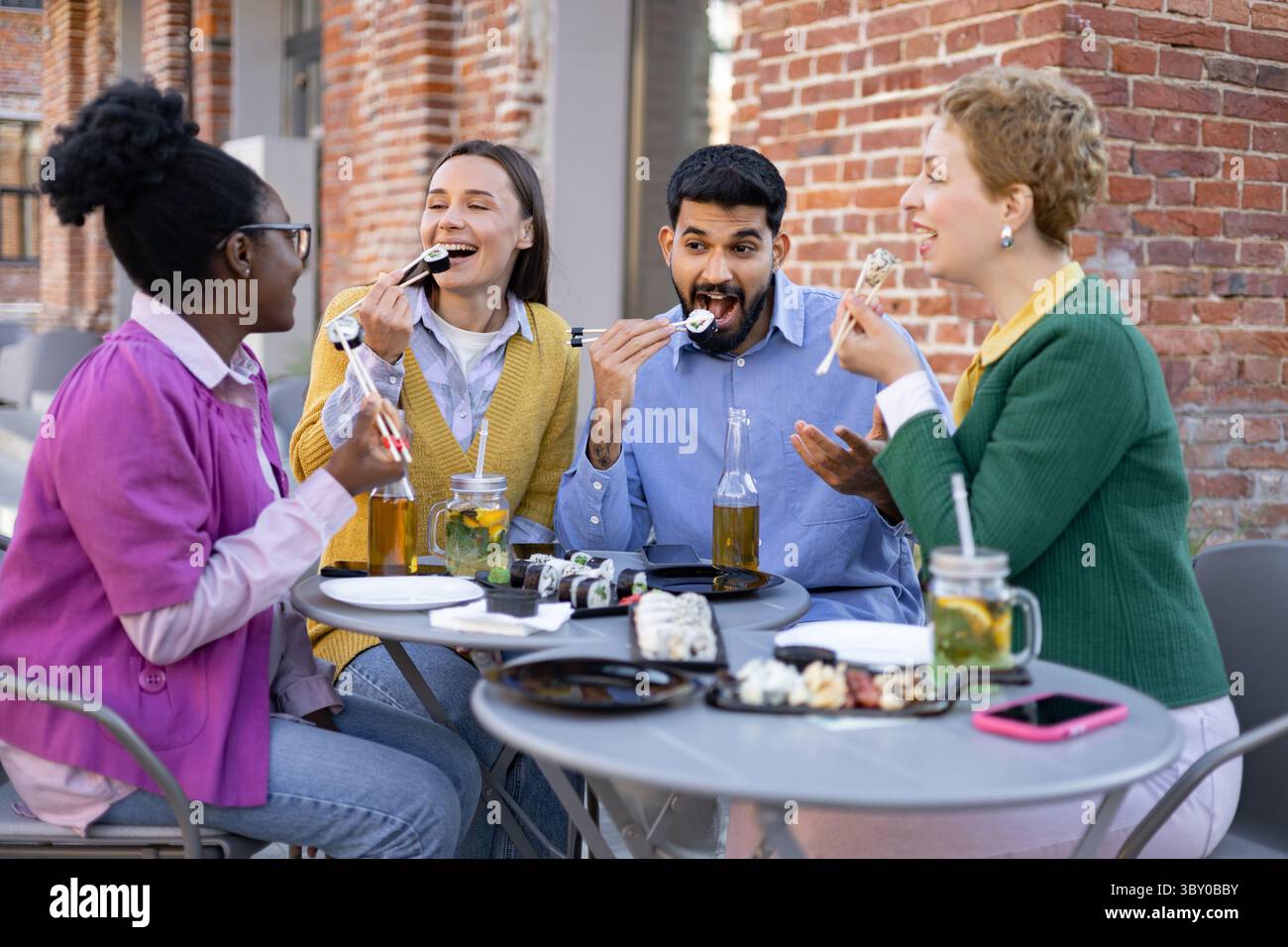 Japanese indian caucasian eating sushi hi-res stock photography and ...