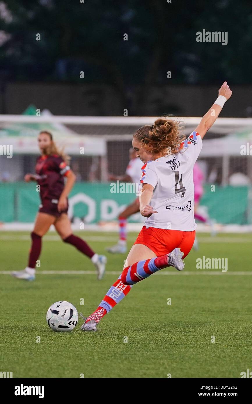 Stephanie Hill #4 of Montreal Roses FC kick the ball during the ...