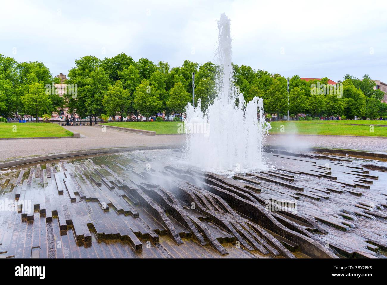 Berlin, Germany - June 1, 2025: Fountain with dynamic water jets and ...