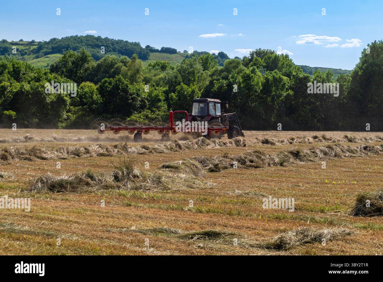 Farmer operates tractor hay hi-res stock photography and images - Alamy