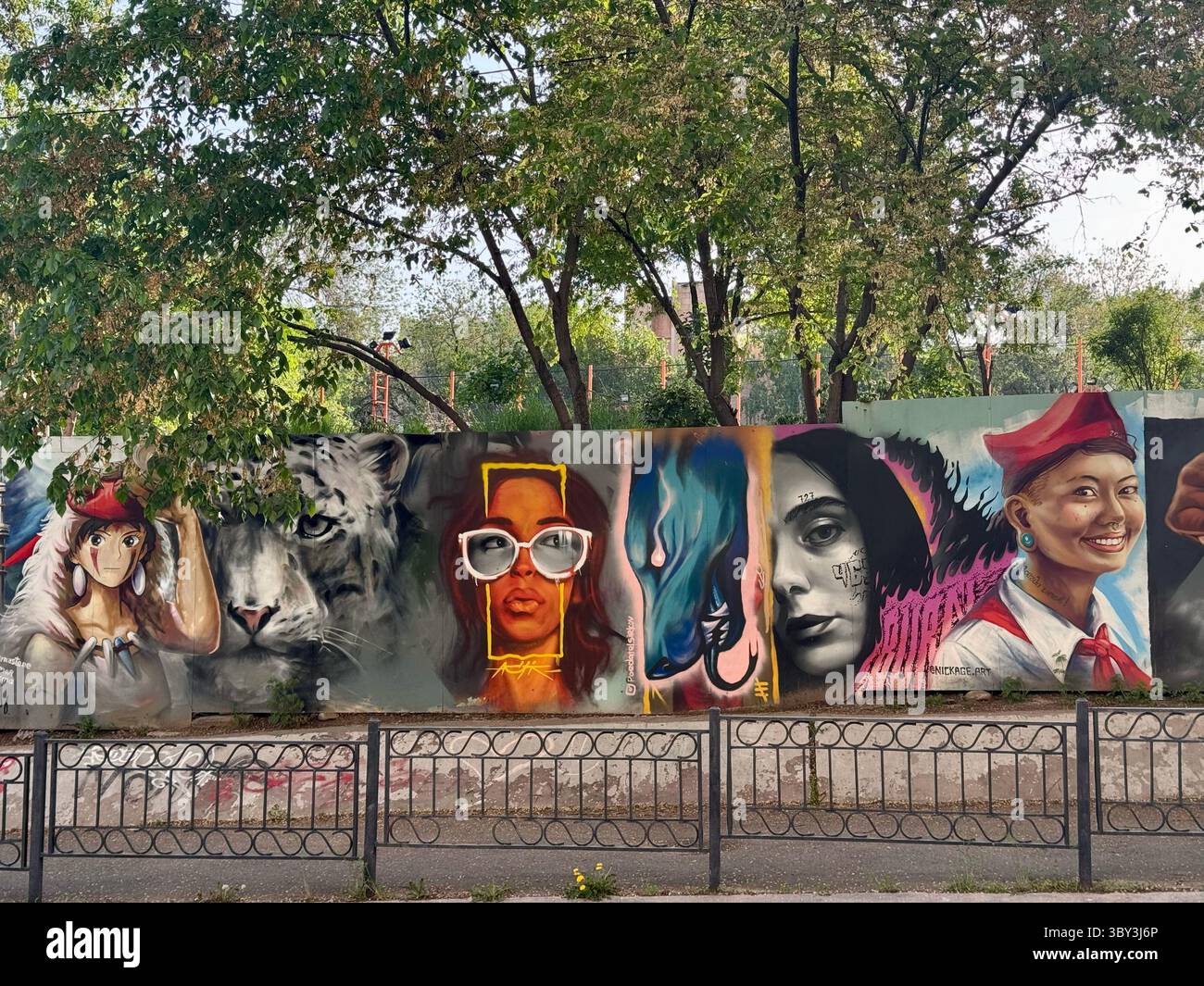 Colorful Street Art Mural on Urban Fence with Portraits and Graffiti ...