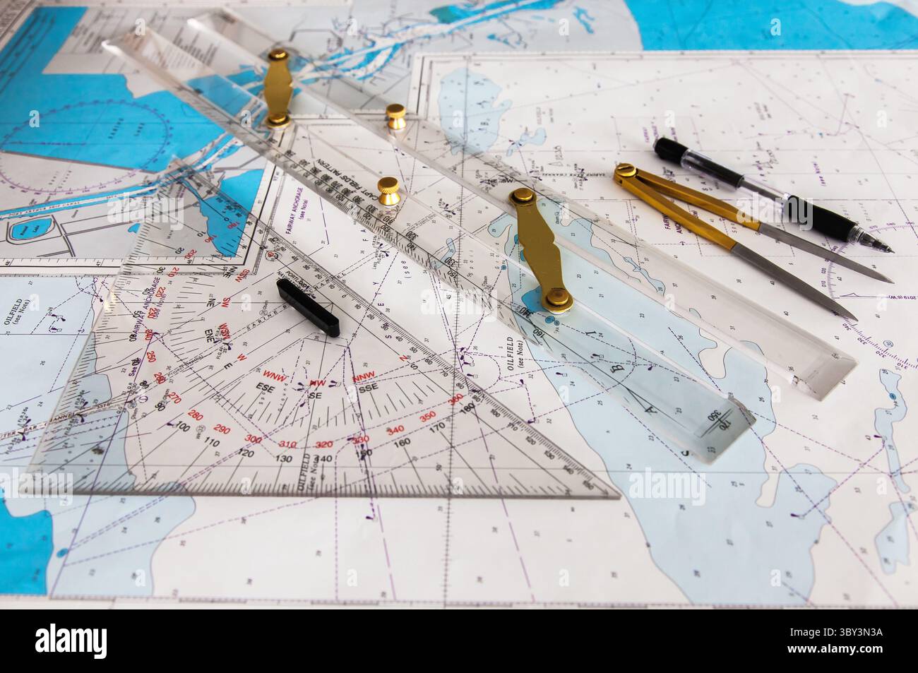 Maps of the ship for plotting. Plotter, divider, ruler and pen. Close ...