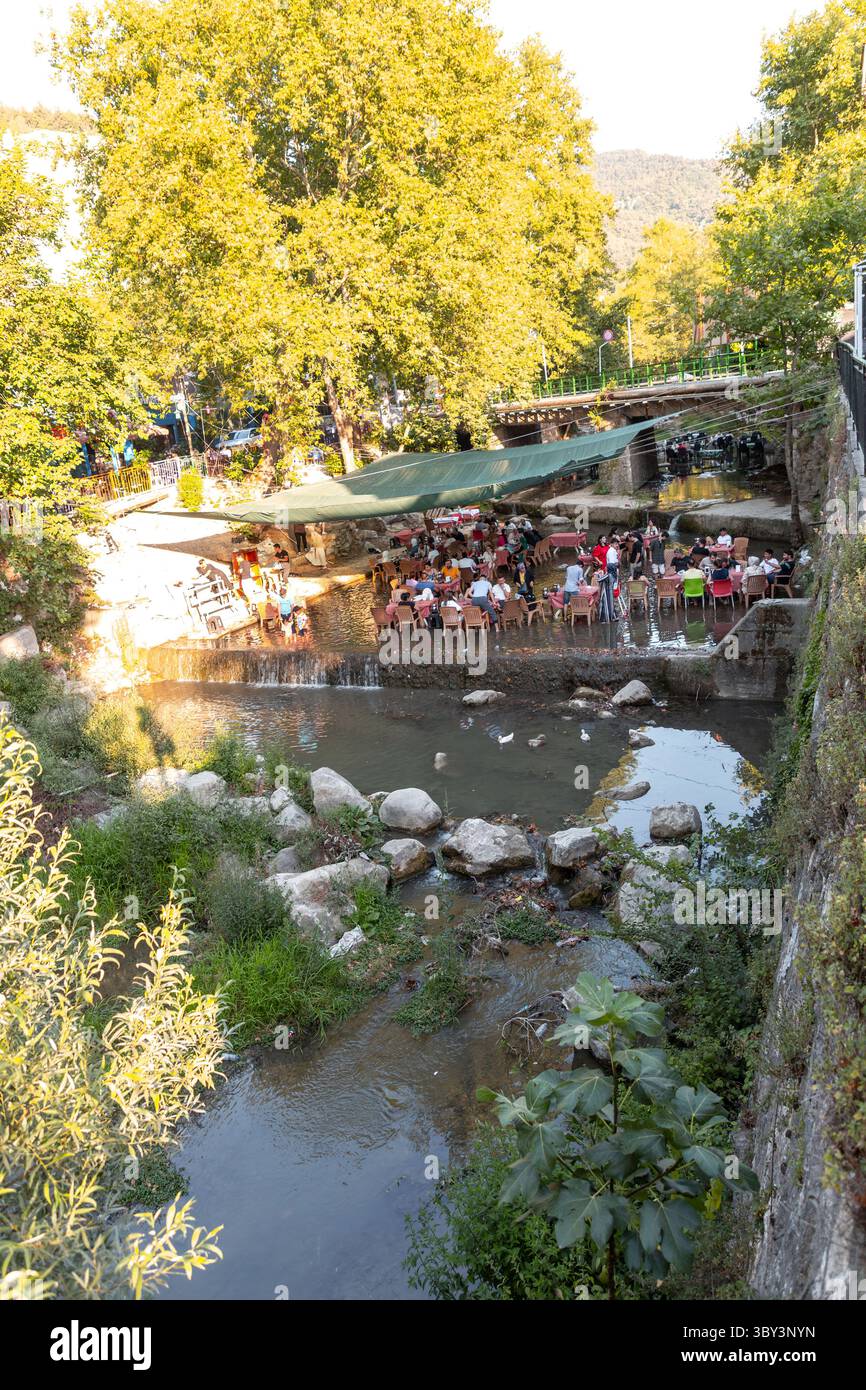 Bursa, Turkiye - 6 July 2025: People enjoying a summer day sitting on ...
