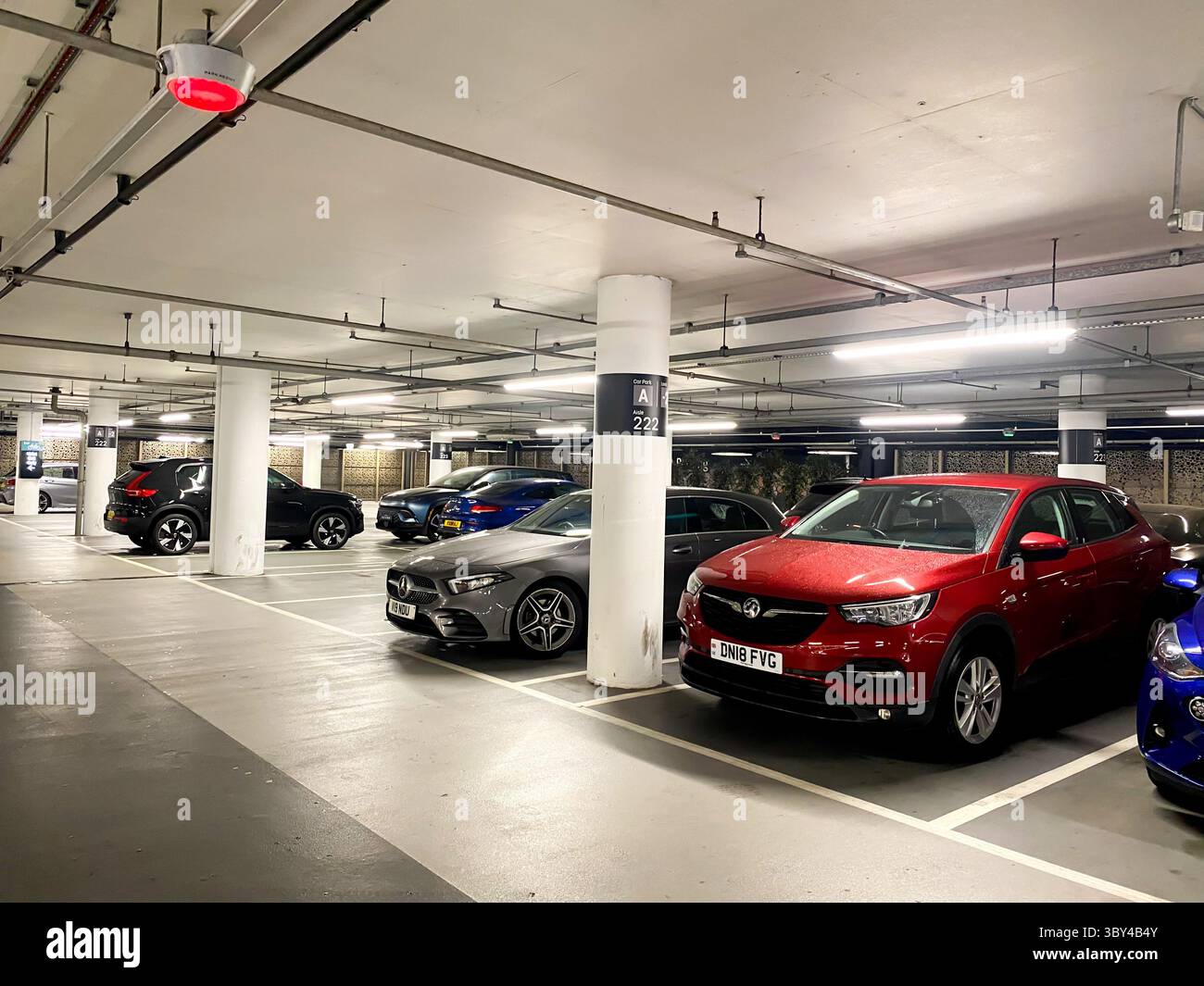 Cars parked in a modern, clean, underground car park in the UK Stock ...