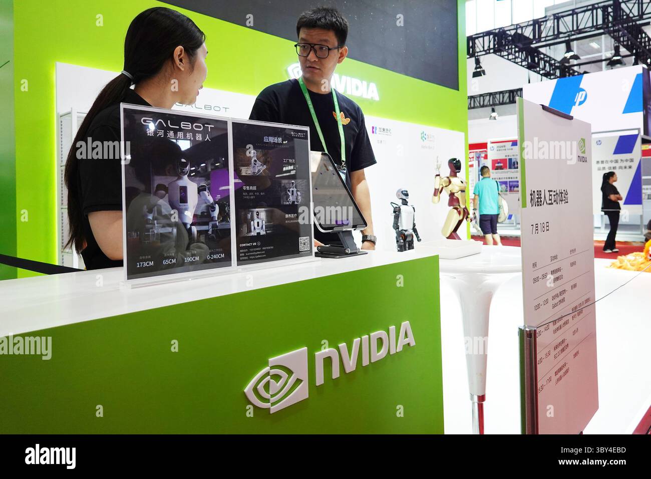 Beijing, China. 18th July, 2025. Staff members seen at the NVIDIA booth ...