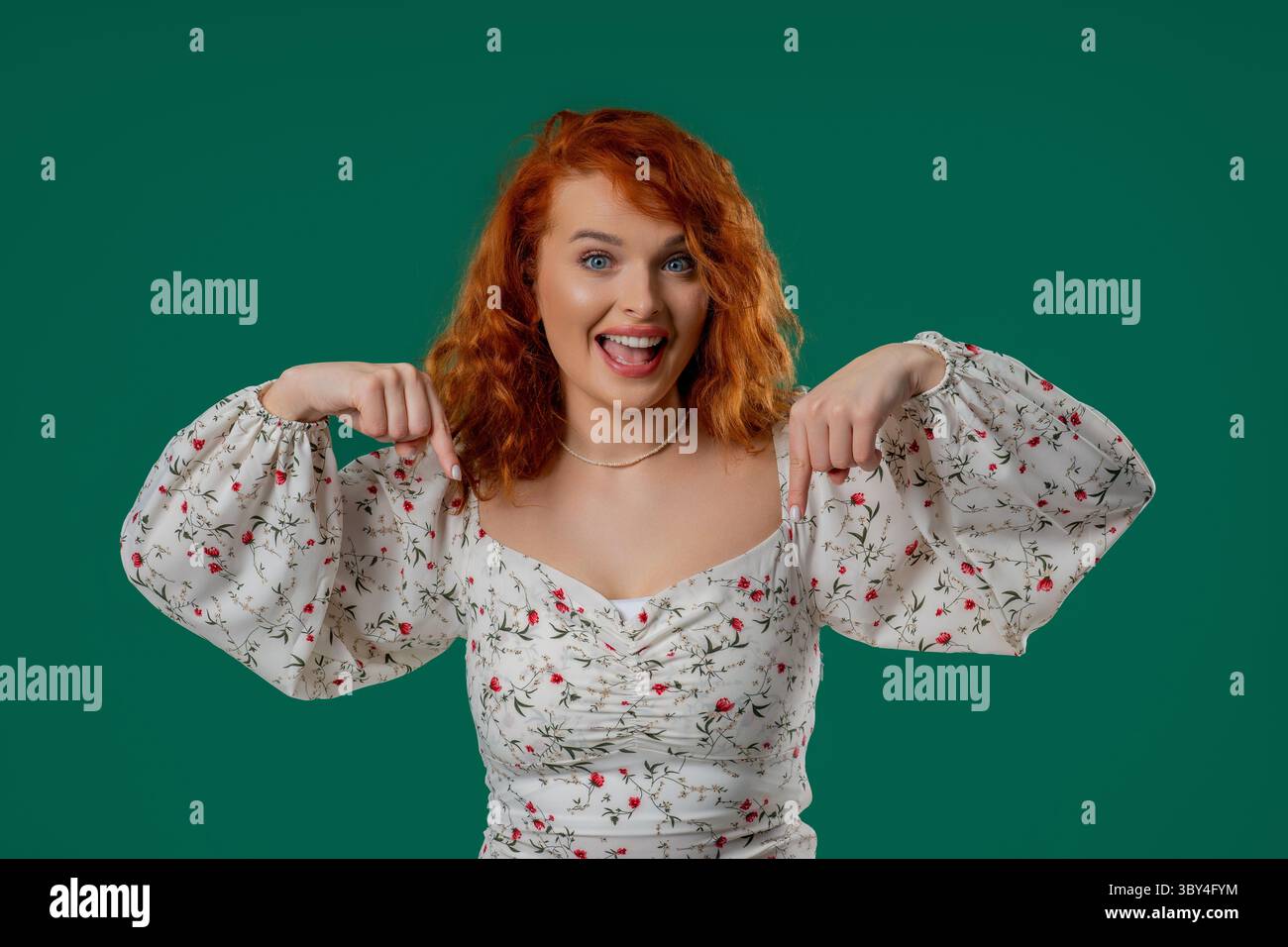 Woman points fingers downward hi-res stock photography and images - Alamy