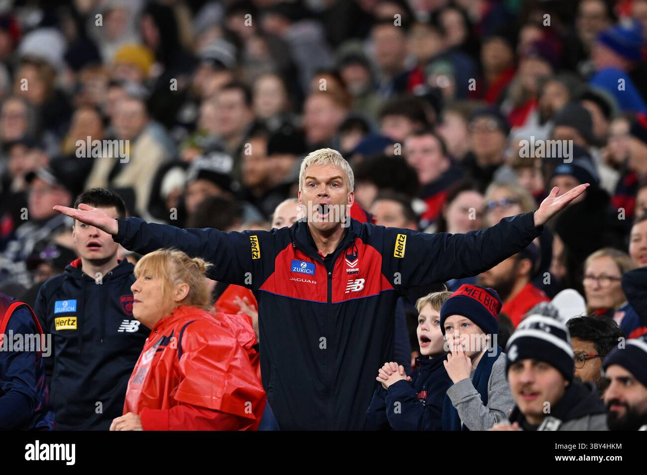 A Melbourne Demons fans reacts during the AFL Round 19 match between ...