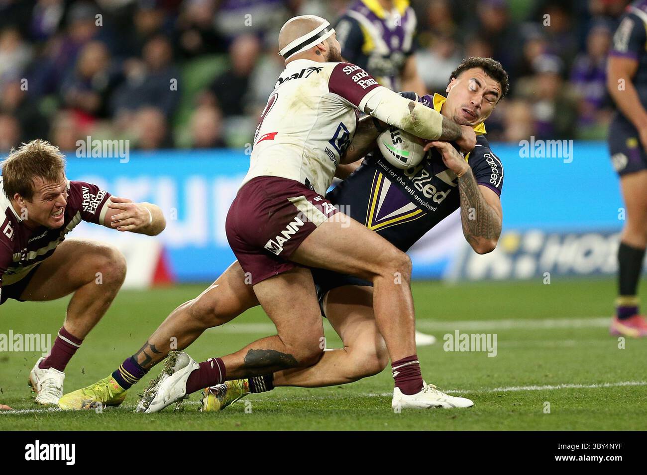 Joe Chan of the Storm is tackled during the NRL Round 20 match between ...