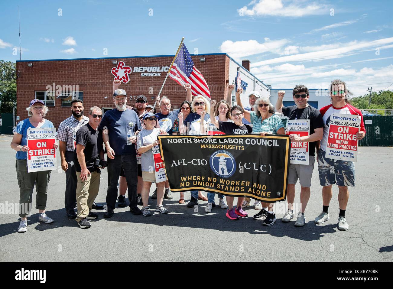 July 18, 2025. Peabody, MA. Striking waste management workers walk the ...