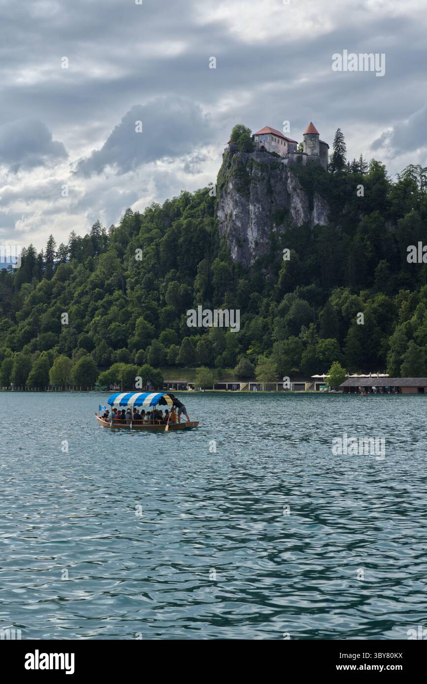 Traditional boat glides across turquoise hi-res stock photography and ...