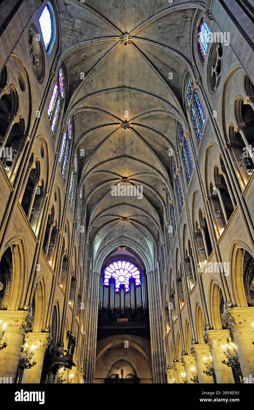 Sublime vaulted ceiling with colourful stained glass window in a ...