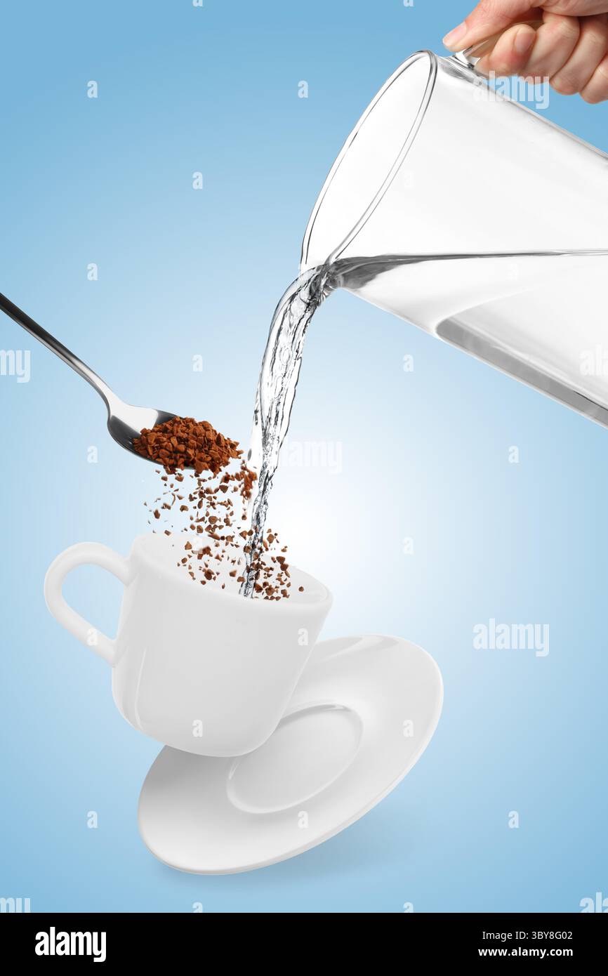 Instant coffee falling out of spoon. Woman pouring water into cup ...