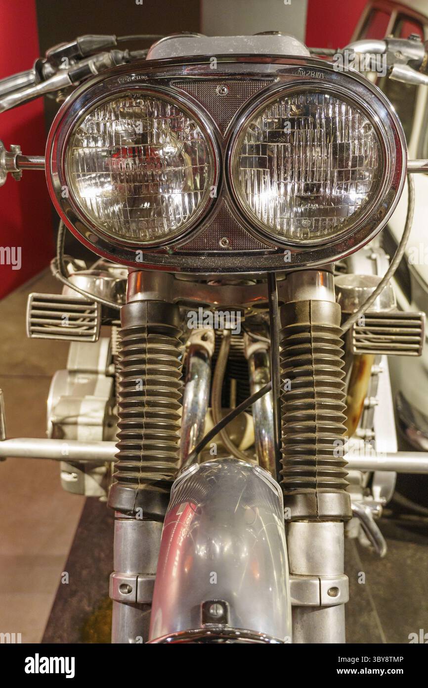 Front view of a motorbike with twin headlights and distinctive metal ...