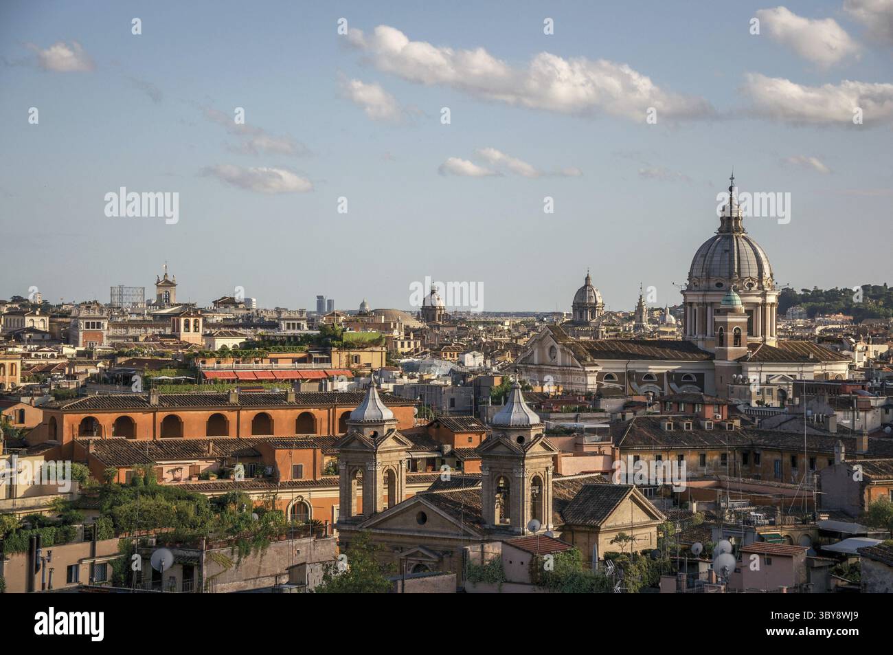 Overview cathedrals domes and roofs of buildings in the sunset of Rome ...