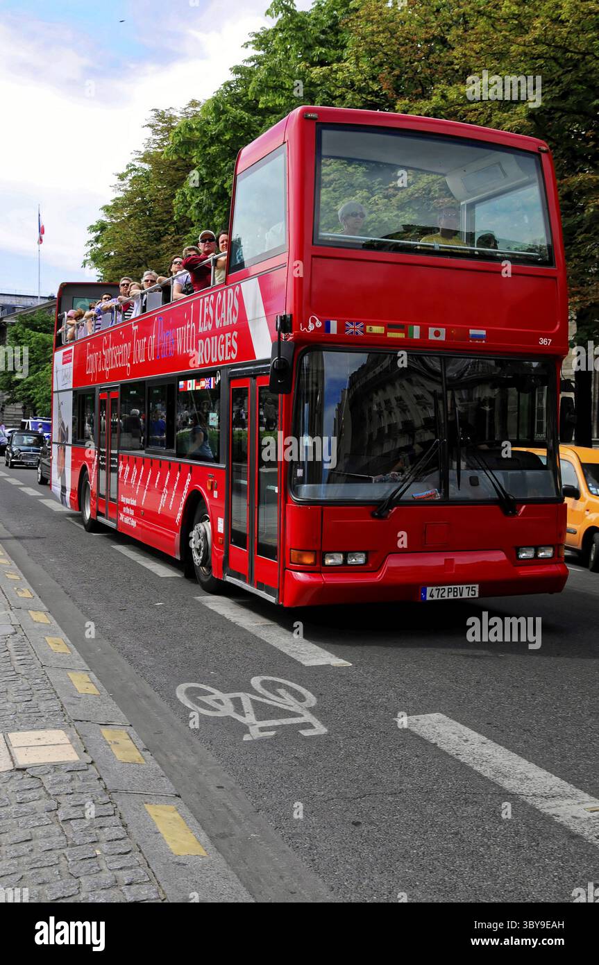 Red double-decker bus with tourists on a street in Paris, Paris, France ...