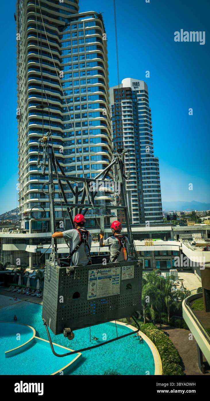 Two construction workers are working outdoors Two construction workers ...