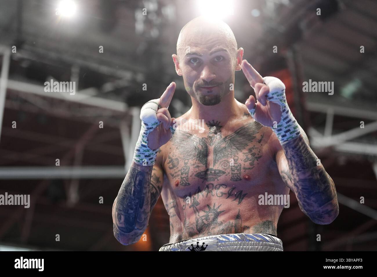 Lasha Guruli celebrates winning their Super lightweight bout against ...
