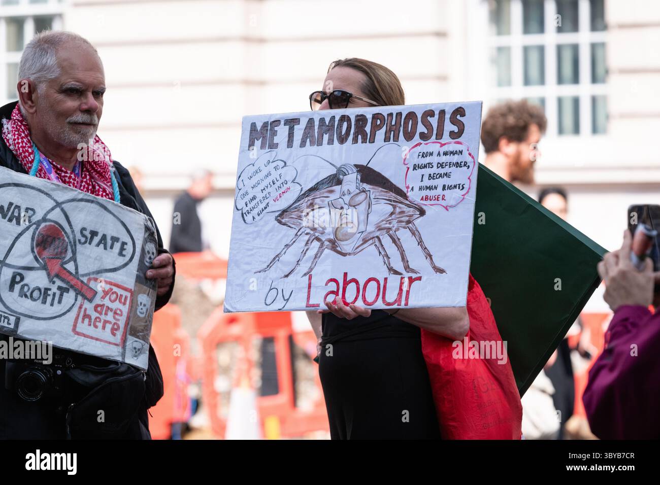 London, UK. 19 July, 2025. A woman holds a placard depicting Sir Keir ...
