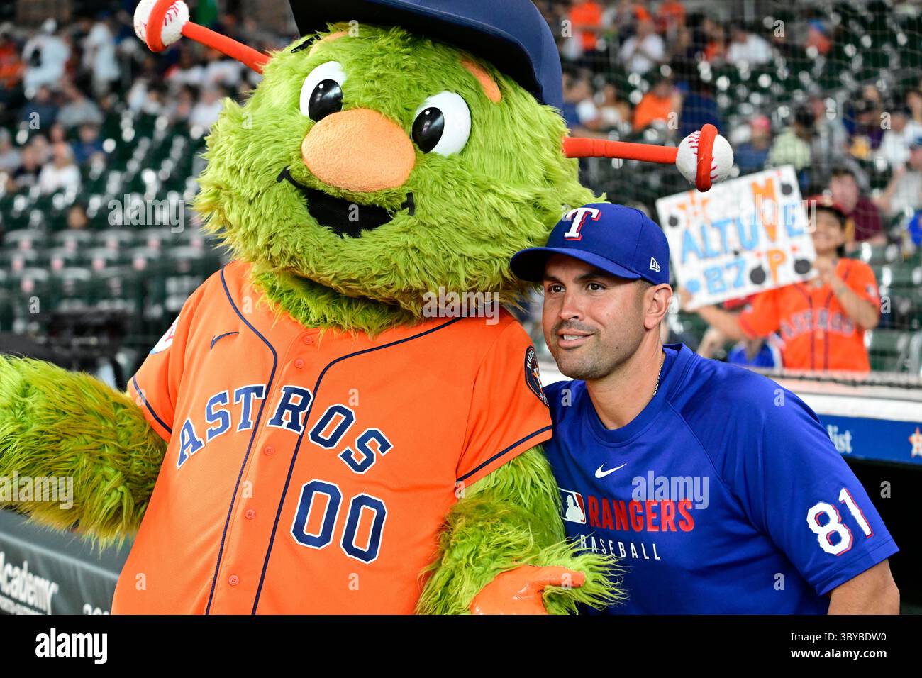 Houston Astros mascot Orbit poses with Texas Rangers bench coach Luis ...