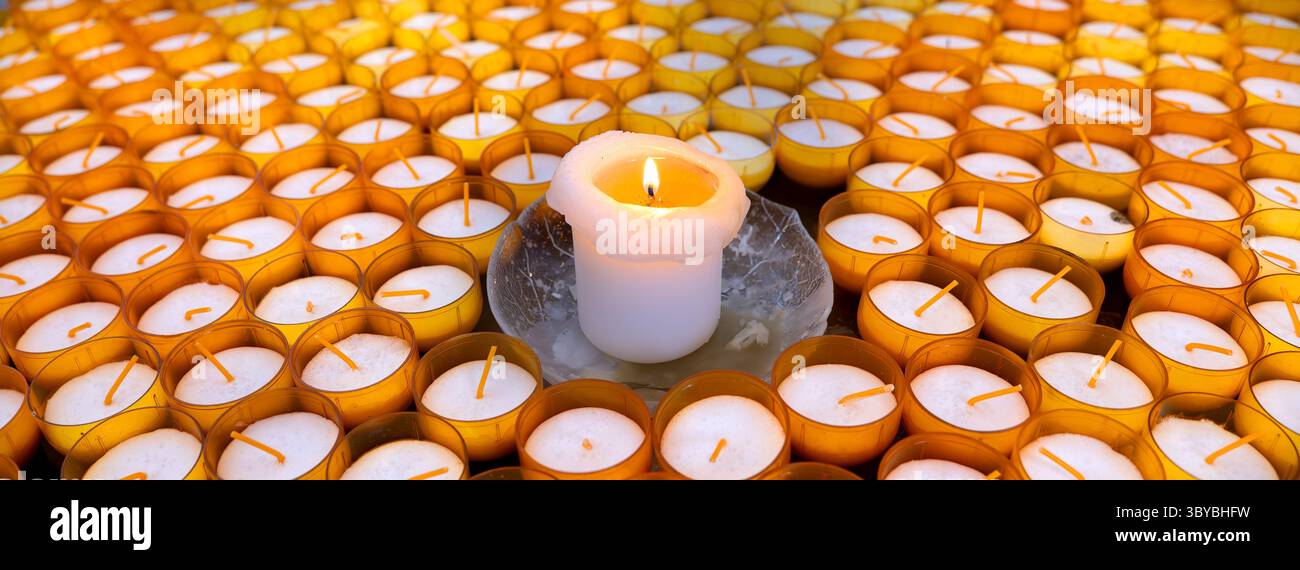 Softly flickering white candle flame hi-res stock photography and ...