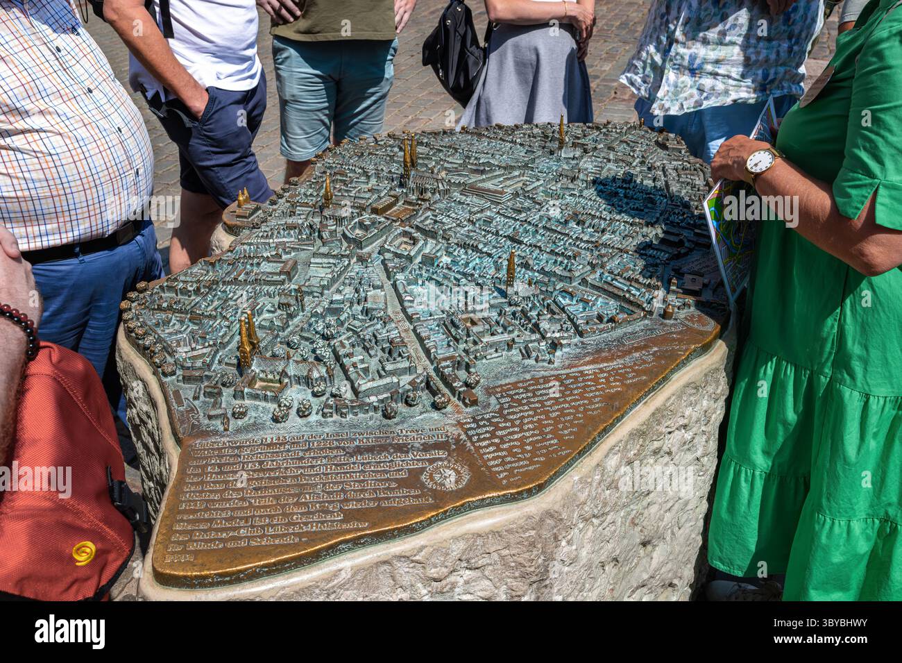 Lubeck, Germany - July 2, 2025: A detailed bronze relief map of a ...