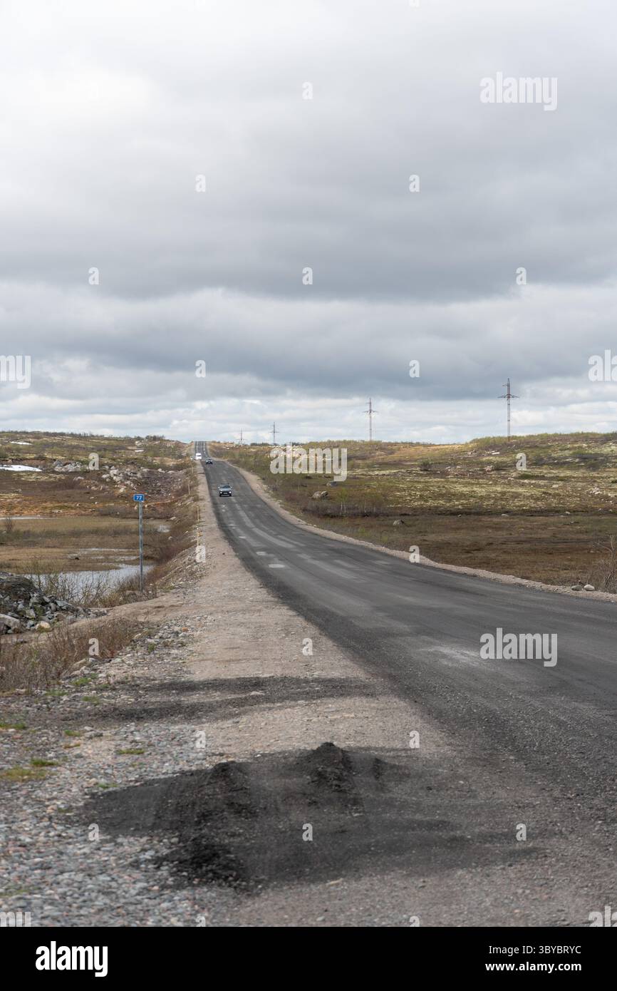 Teriberka, Russia - June 13, 2025: A remote road stretches through the ...