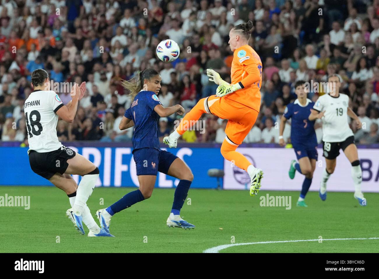 France goalkeeper Pauline Peyraud-Magnin, right, playes the ball ahead ...