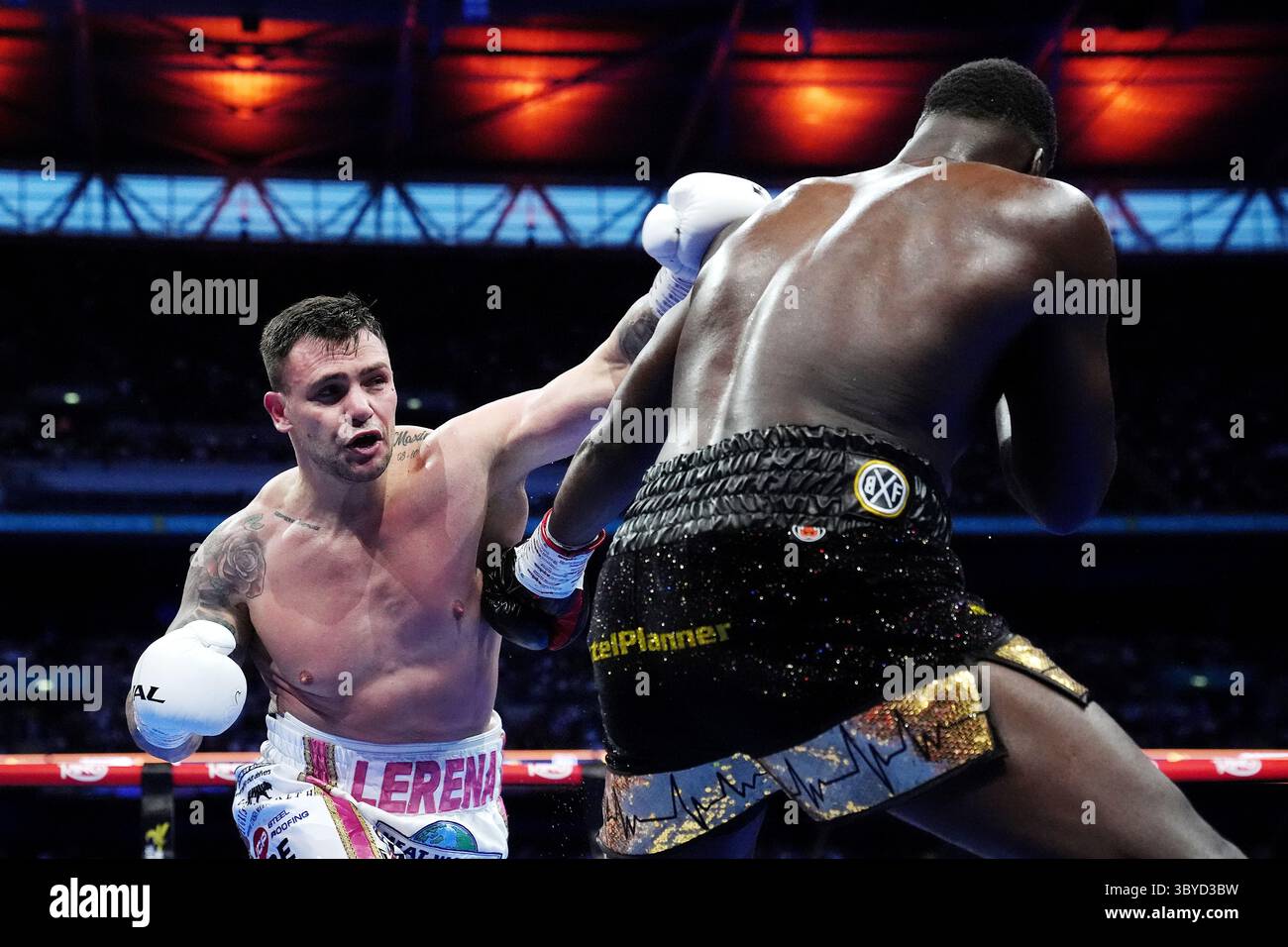 Kevin Lerena (left) lands a punch on Lawrence Okolie during their WBC ...