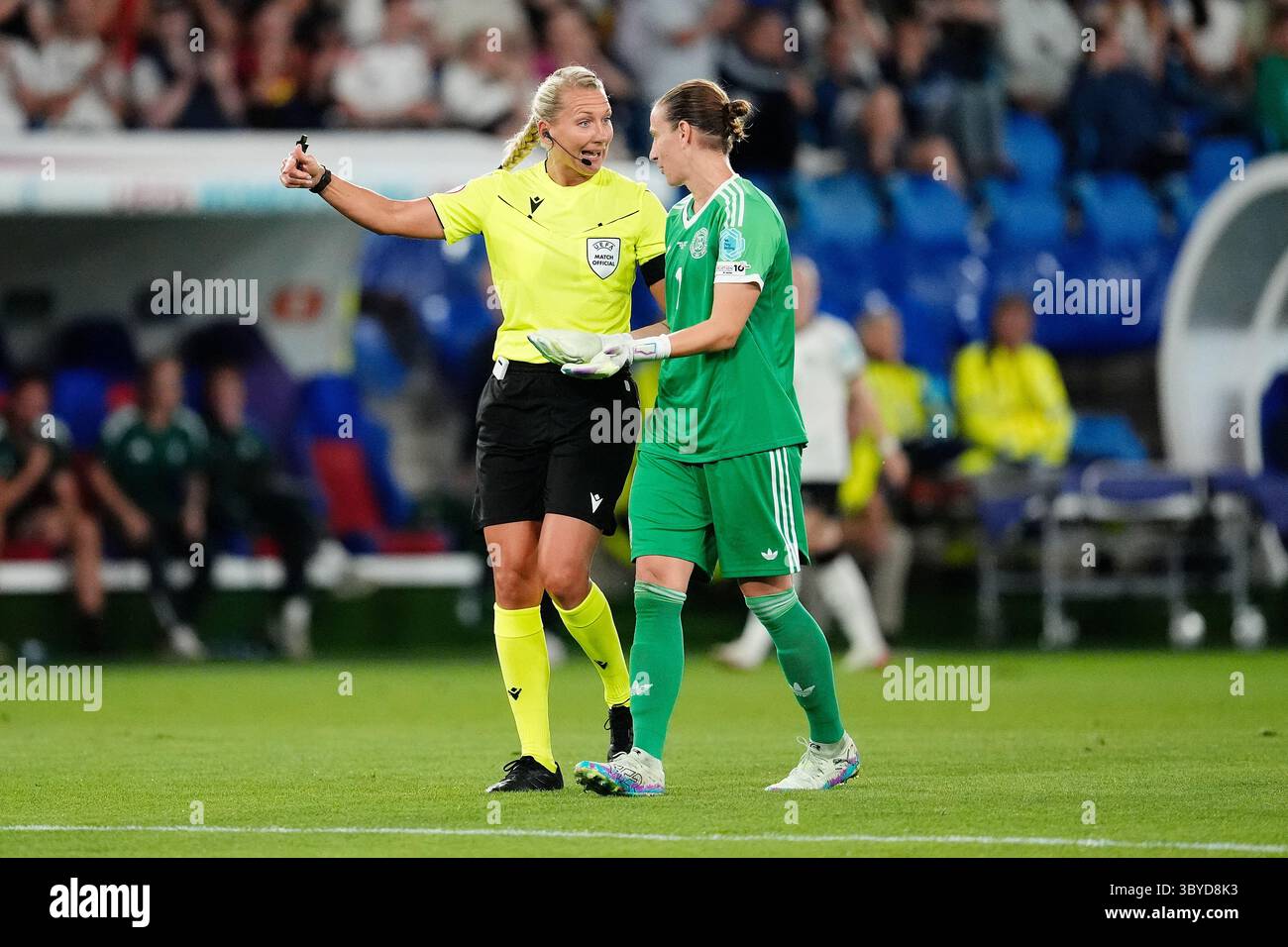 Referee Tess Olofsson (left) speaks to Germany goalkeeper Ann-Katrin ...