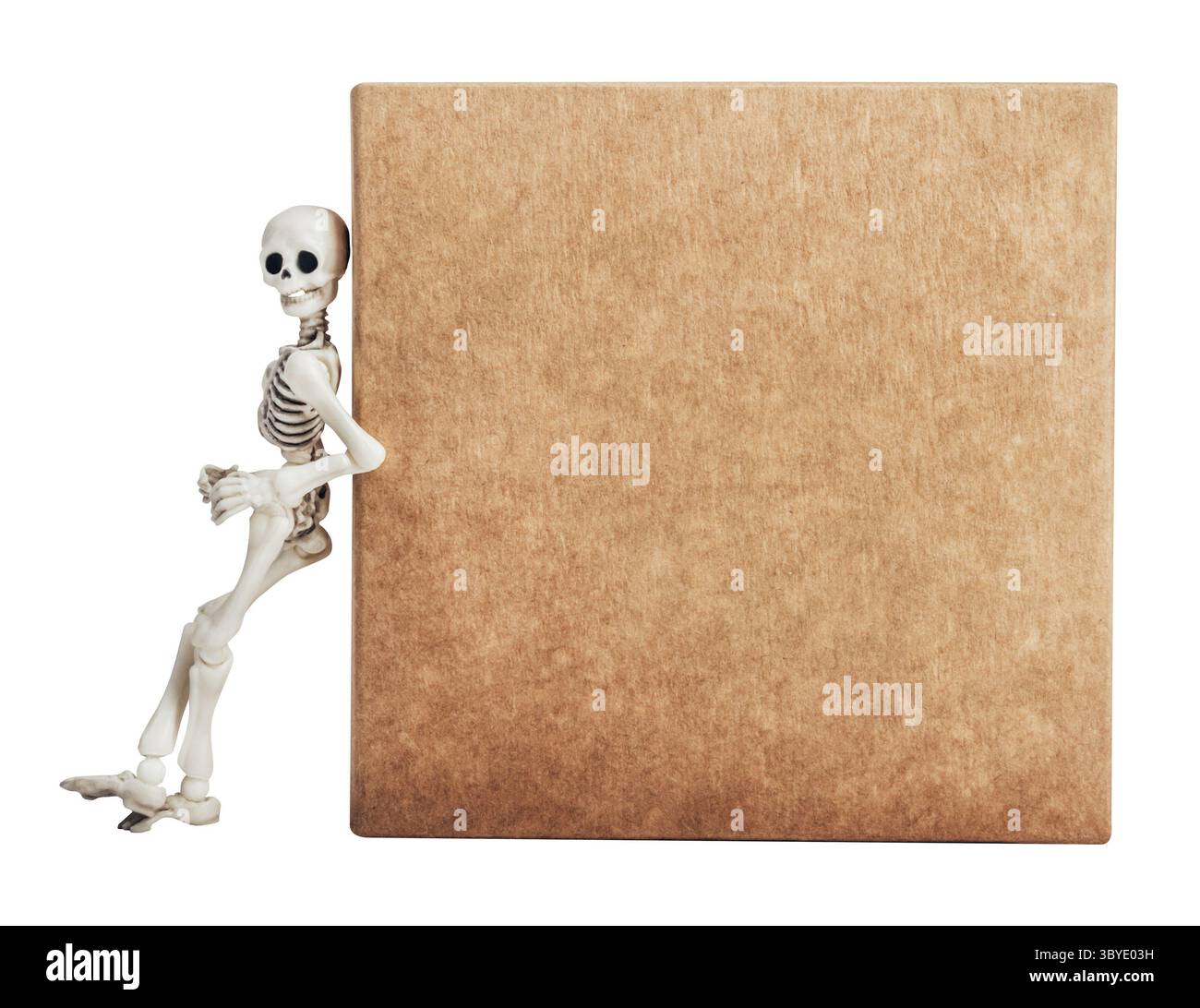 Isolated photo of toy skeleton standing and leaning on carboard box on ...