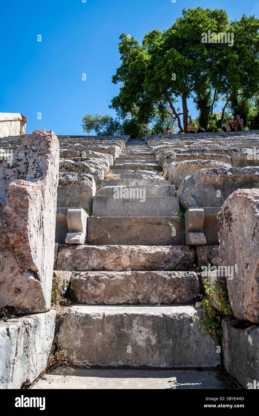 Epidaurus, Greece - May 11, 2025: Visitors explore the ancient stone ...