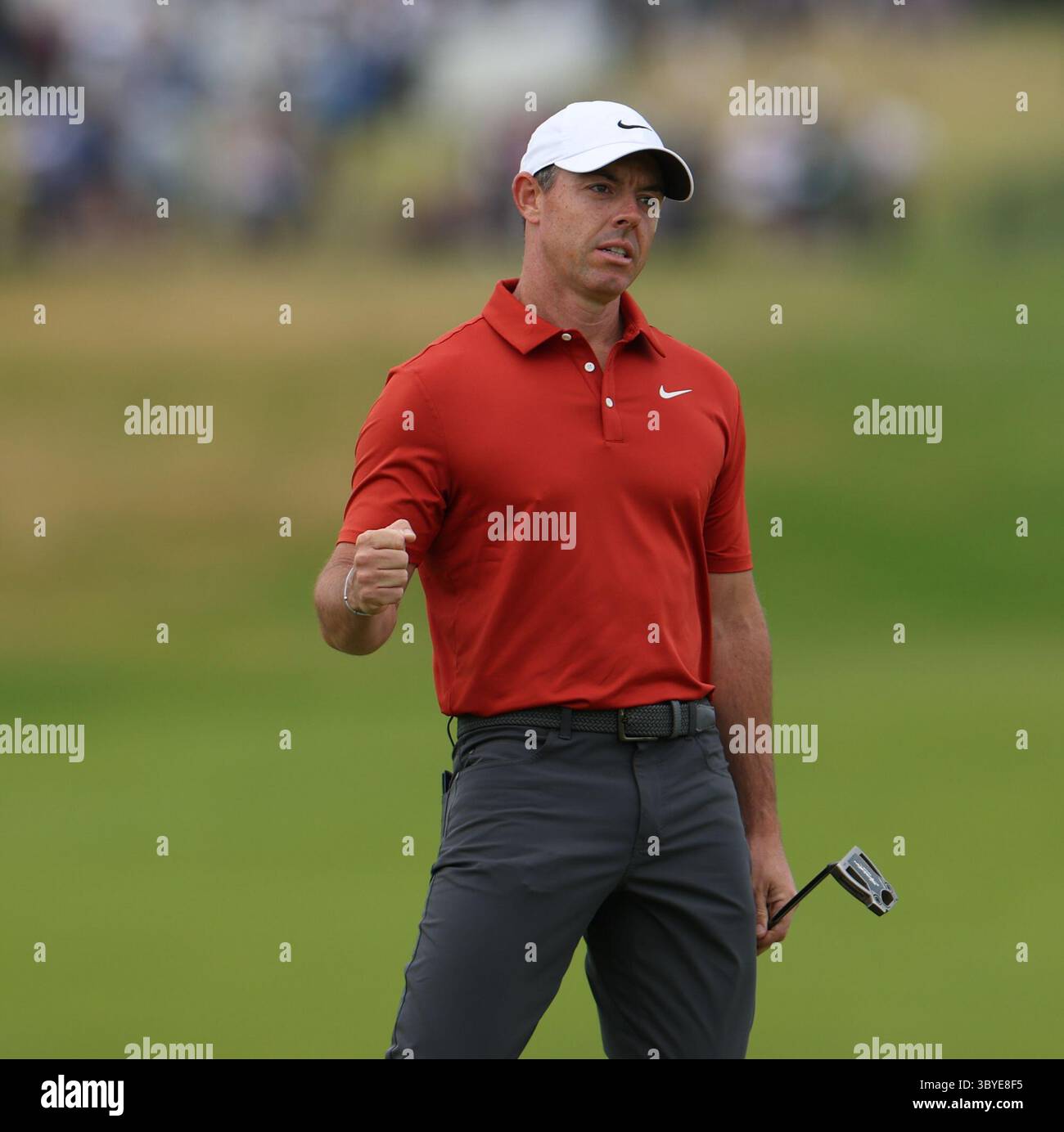 Rory punches the air after his Birdie putt at the 1st Out on the Third ...
