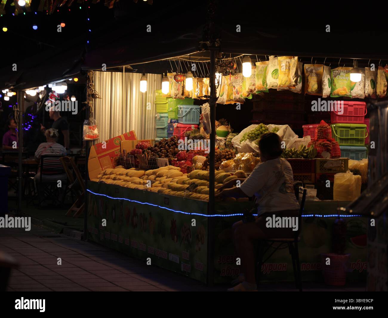 A Vibrant Night Market Stall filled with an array of Fresh Produce and ...