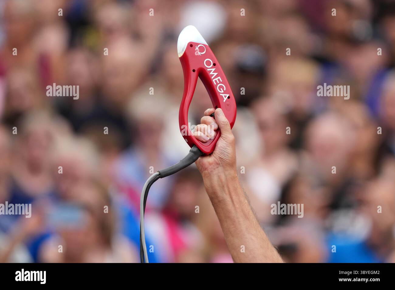 An official fires an Omega electronic starting gun during the London ...